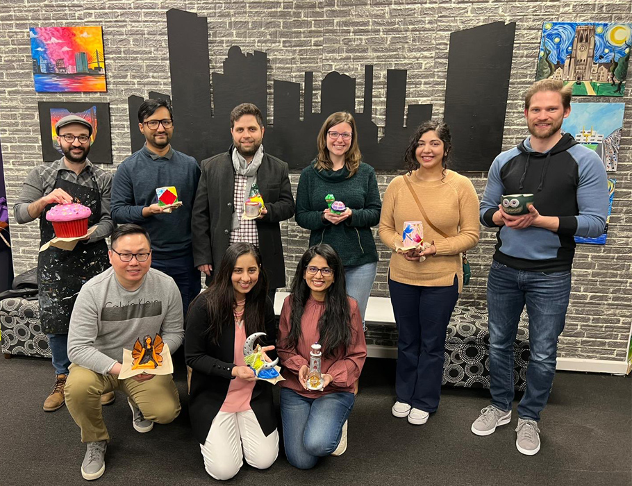 Resident activity at Art Lab 419, holding up their artwork.